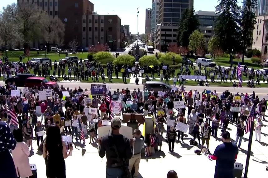 Coronavirus: Hundreds protest against US rules amid spreading ...