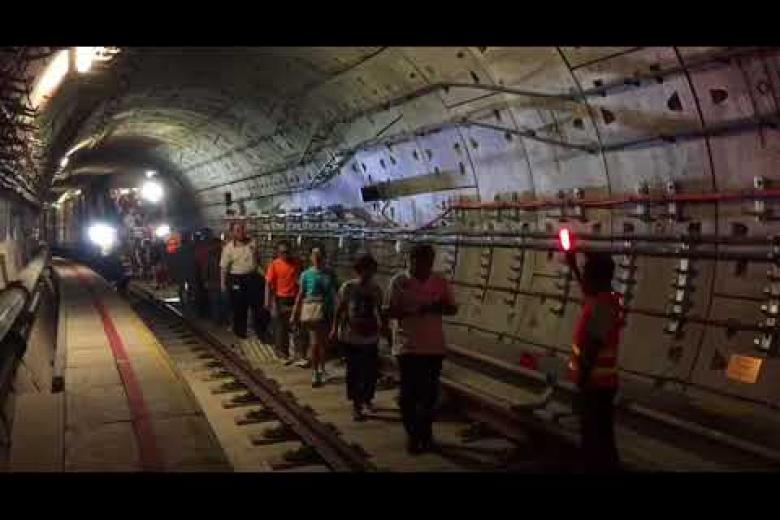 Visitors walk along train tracks for Downtown Line 3 sneak peek event ...