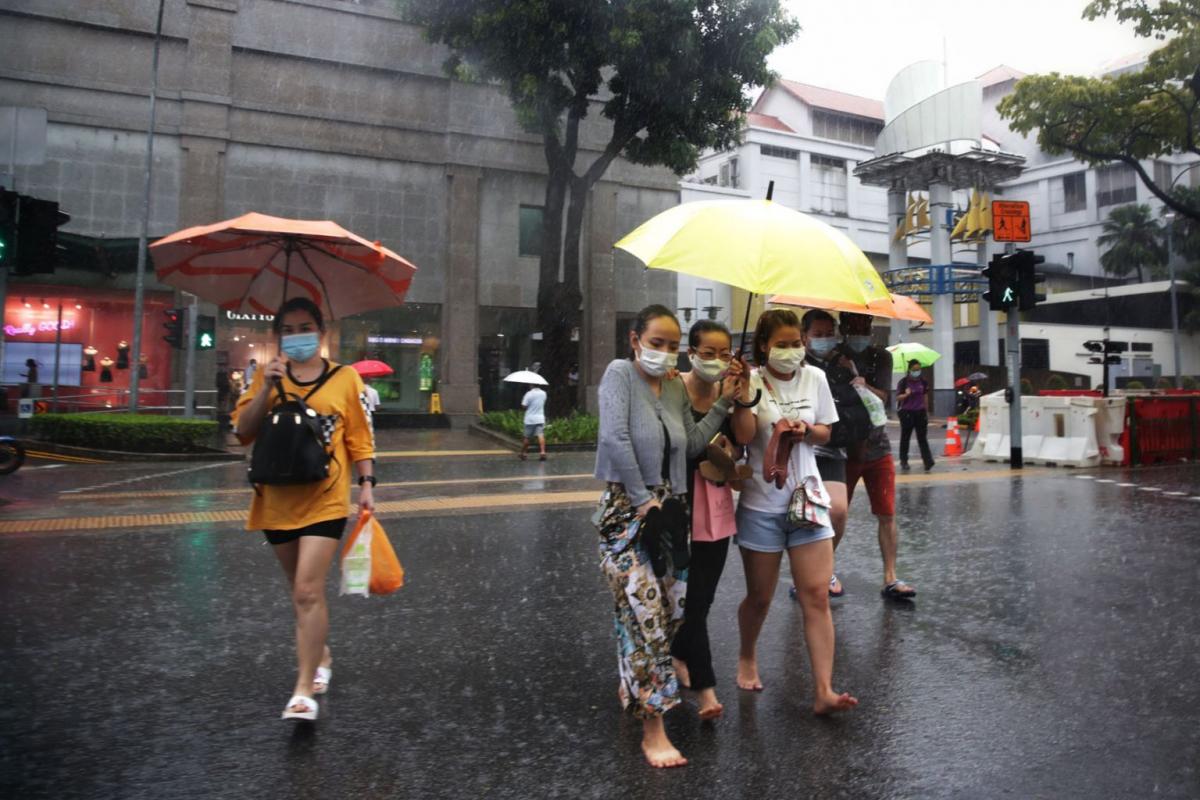 In Pictures: Persistent rain in Singapore sparked by sea breezes ...