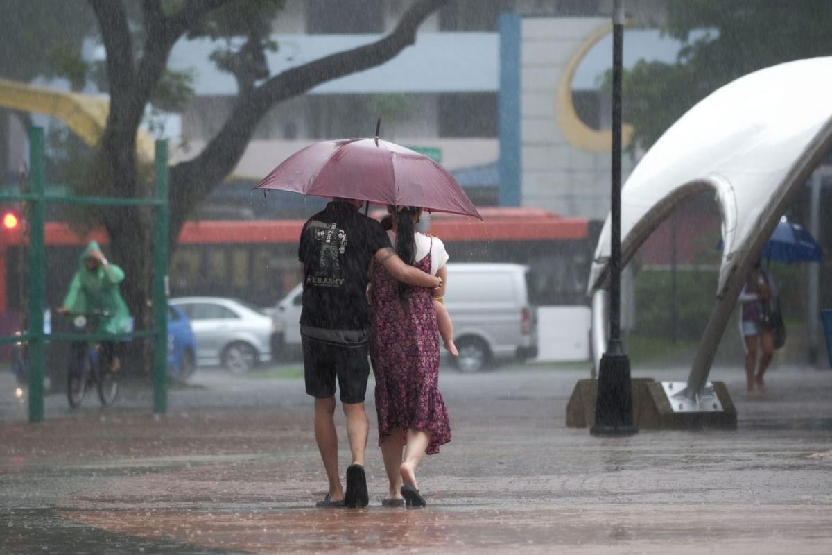 In Pictures: Persistent rain in Singapore sparked by sea breezes ...
