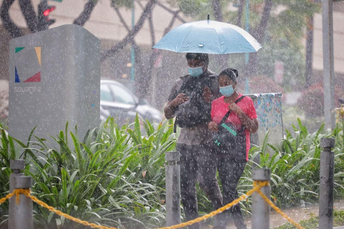 In Pictures: Persistent rain in Singapore sparked by sea breezes ...